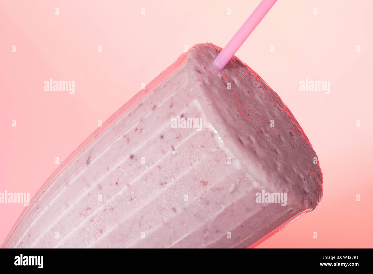 Faluda juice with fresh fruits on glass, pink color cup and background ...