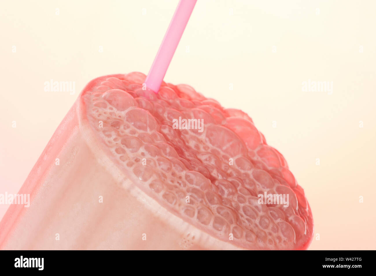 Top view of a fresh juice glass, pink color cup and background ...