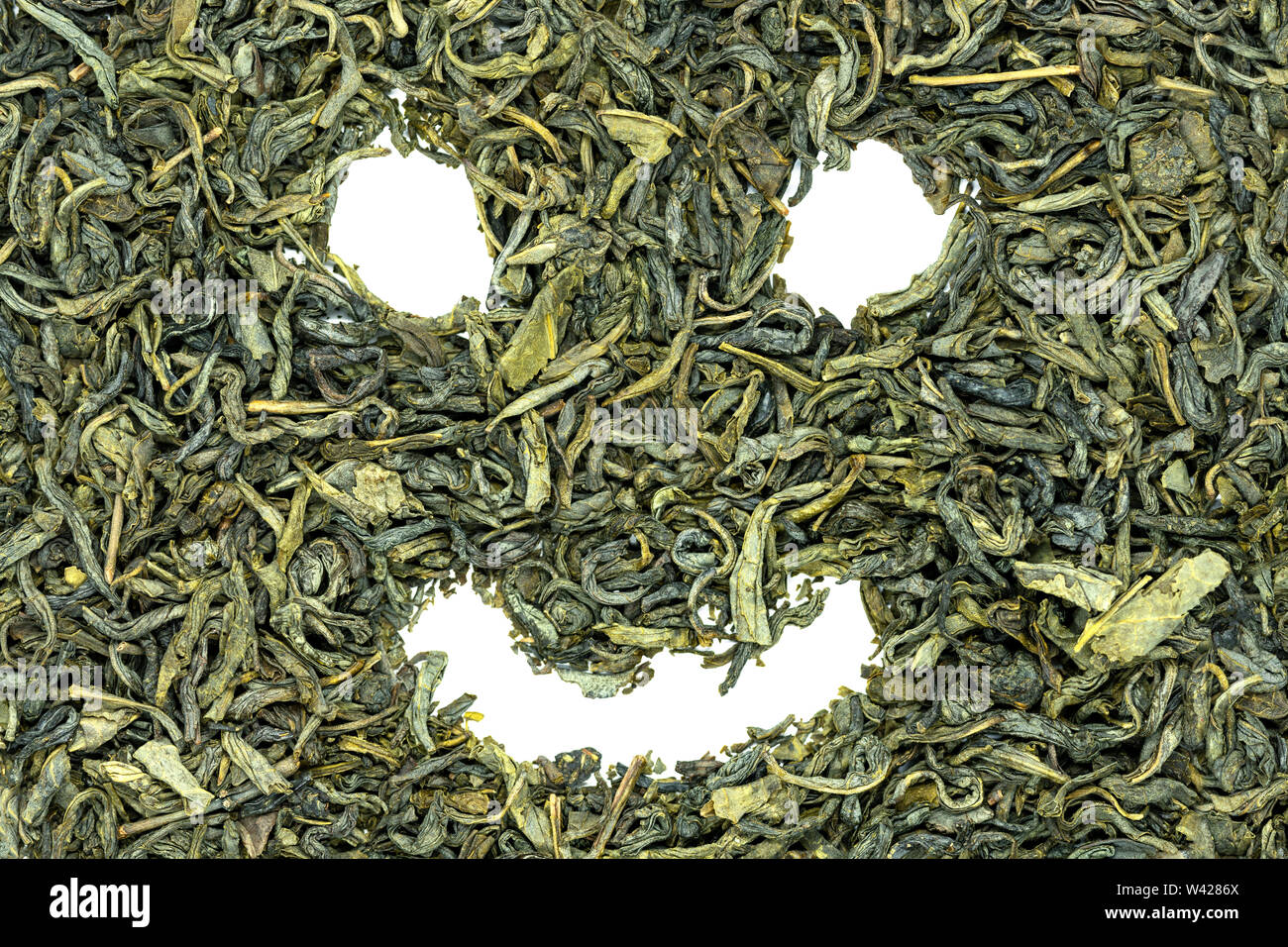 Huangshan Maofeng green tea, funny smiley face, close up. China yellow ...