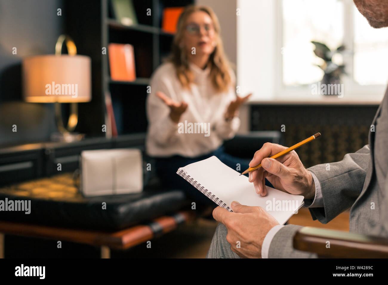 Person listening taking notes hi-res stock photography and images - Alamy