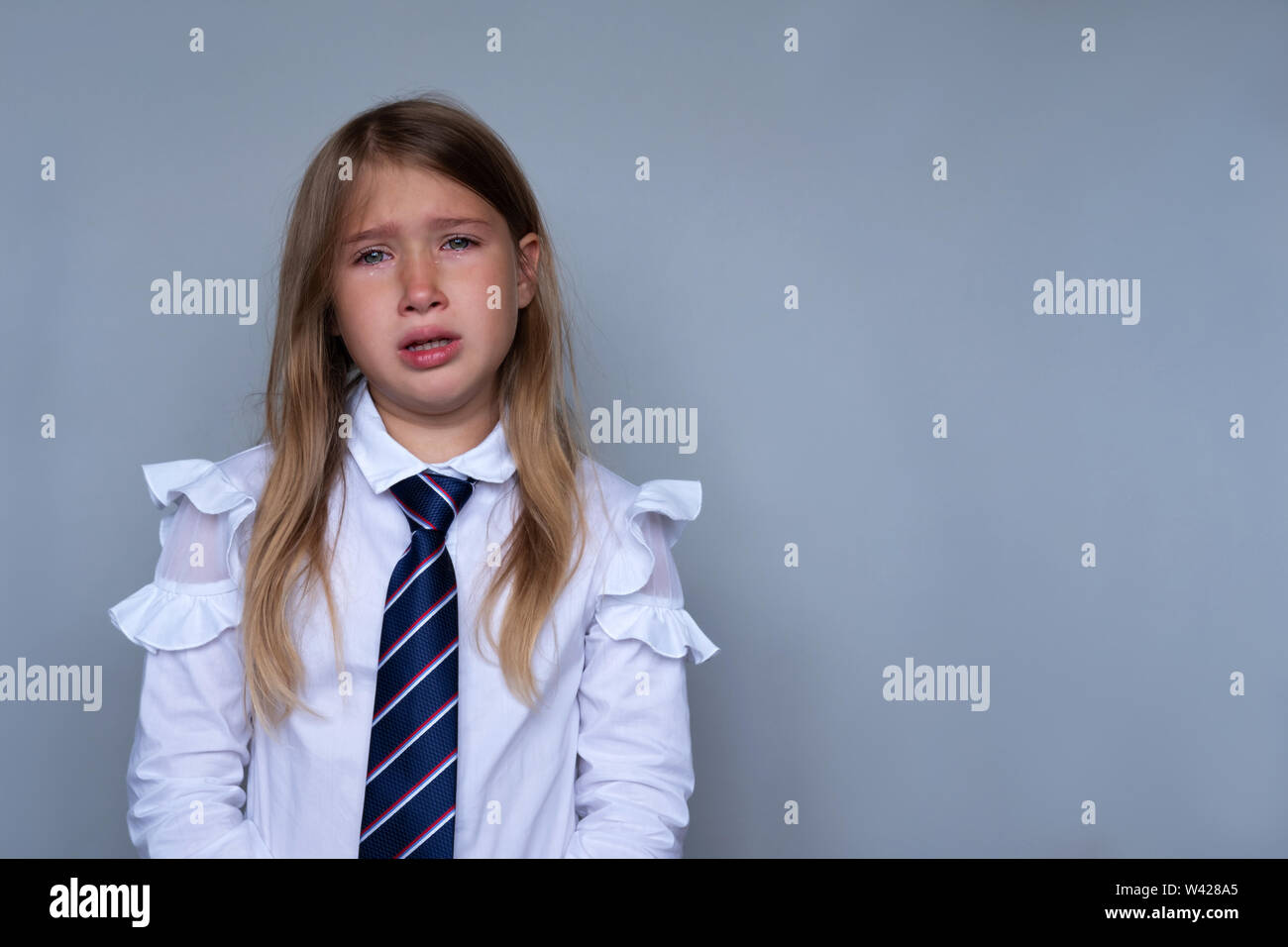 Schoolgirl crying hi-res stock photography and images - Alamy