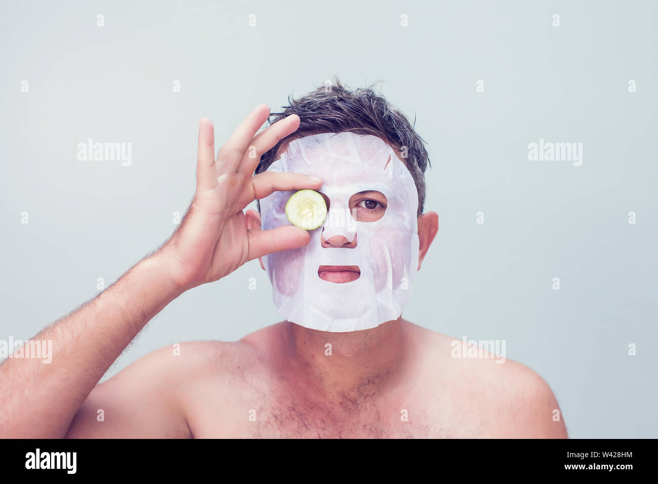 a man in a cosmetic mask skin care Stock Photo - Alamy