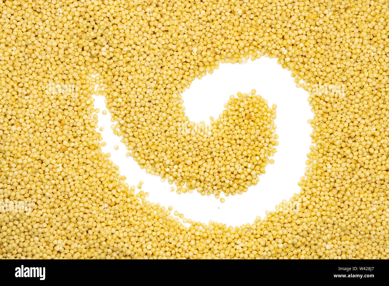 Millet groats, spiral shape, close up, top view. Gluten-Free and non ...