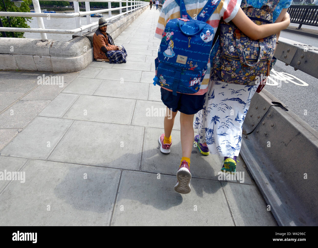 People walking past homeless person hi-res stock photography and images ...