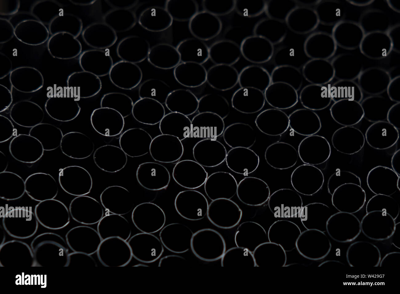 Stainless steel straws vertical abstract background. Metal pipes bundle ...