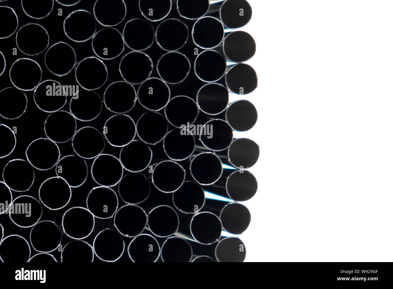 Stainless steel straws vertical abstract background. Metal pipes bundle ...