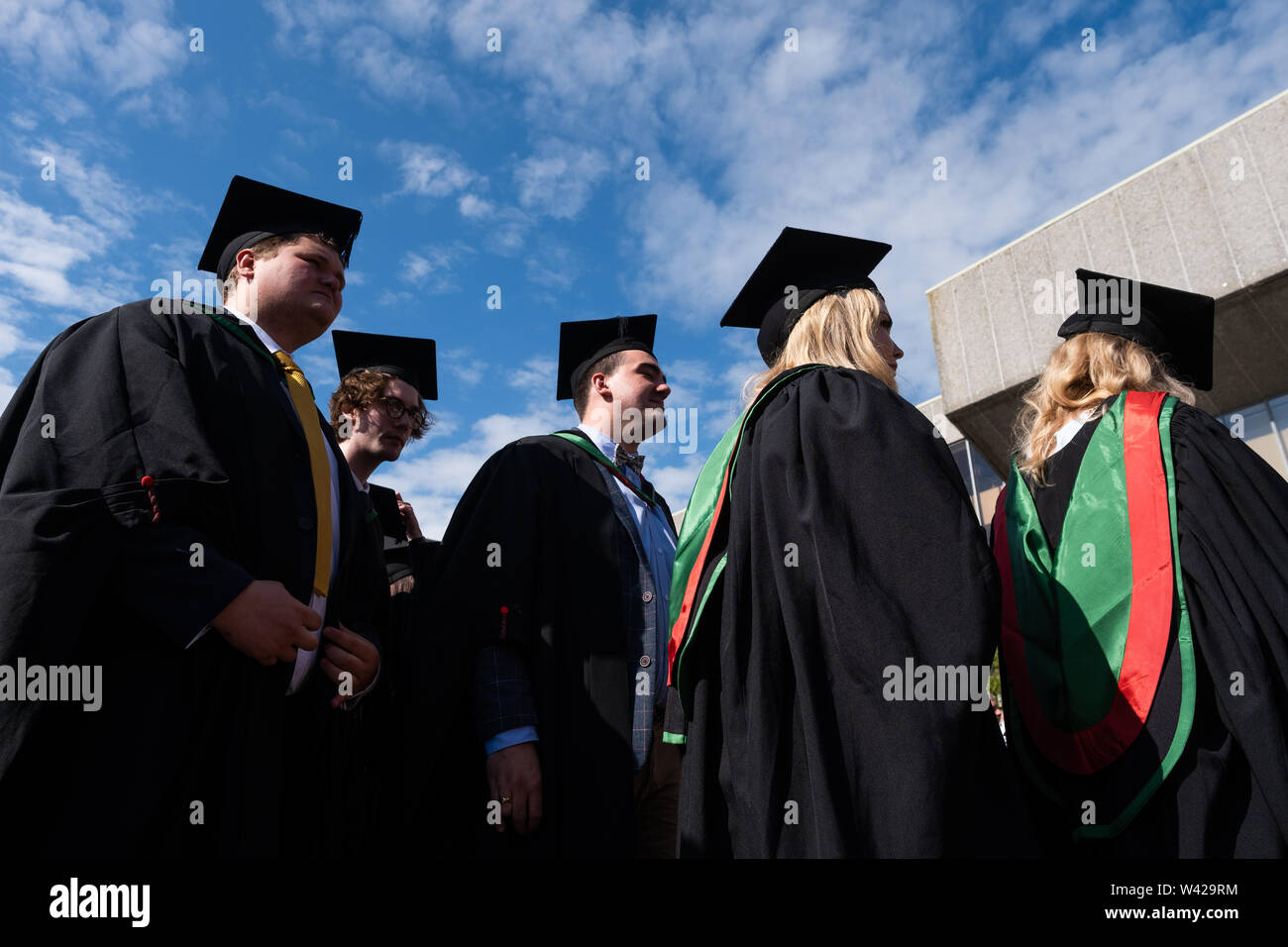 Higher education in the UK - successful students at the graduation ...