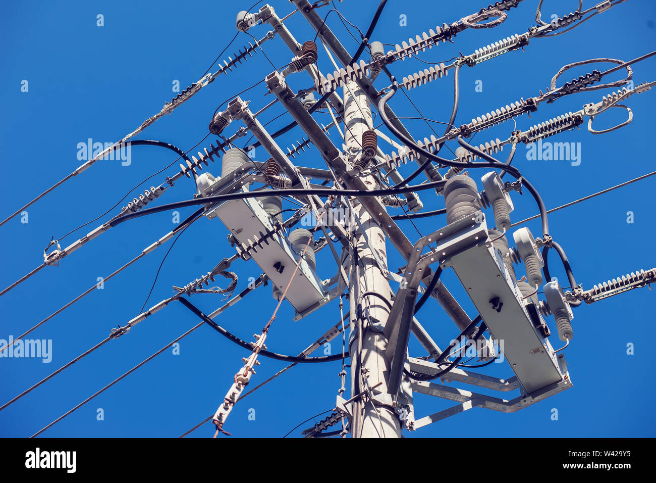 Messy electric wiring on the pole Stock Photo - Alamy