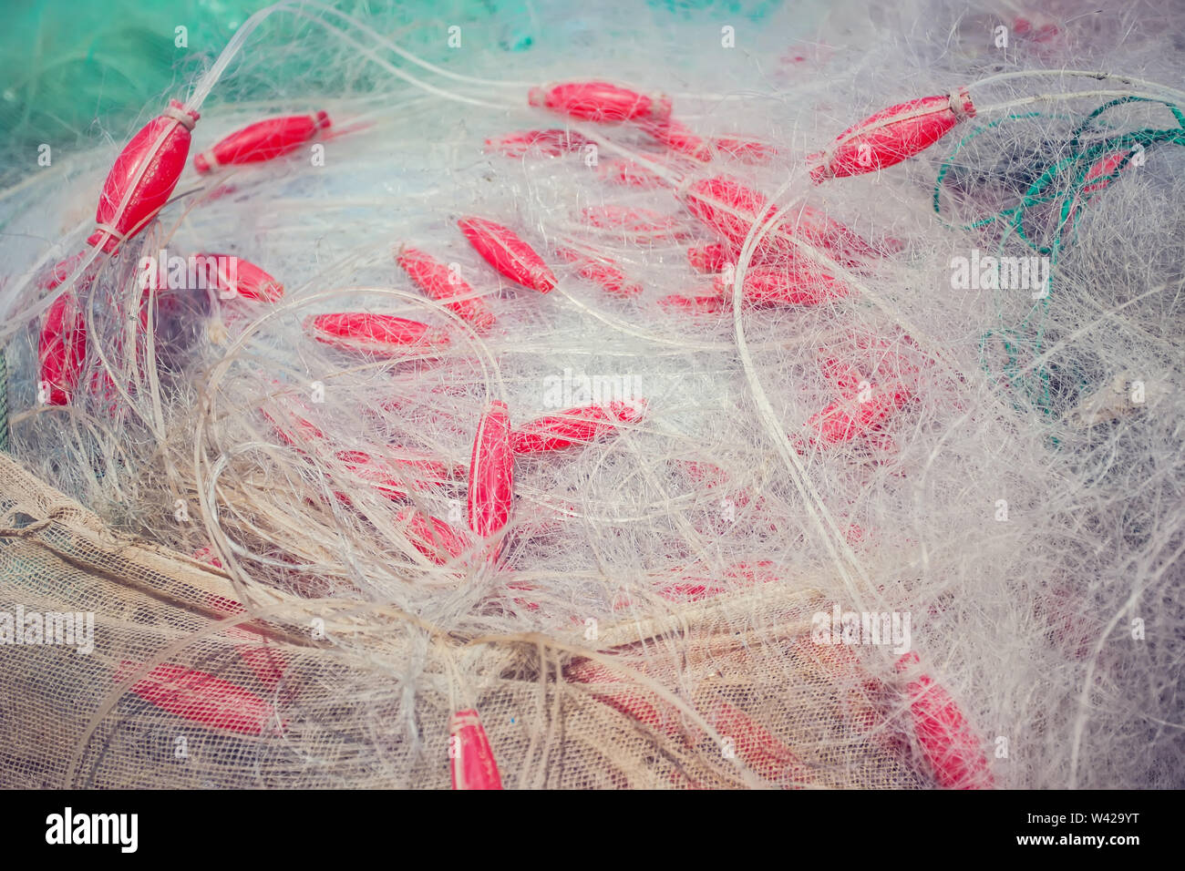 Background of fishing nets and floats Stock Photo - Alamy