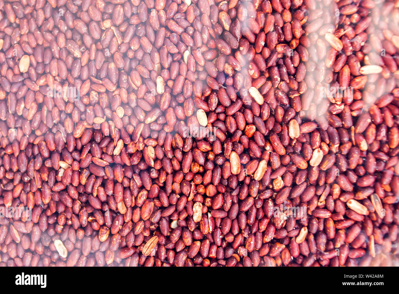 Peanuts in shell of market texture background Stock Photo - Alamy