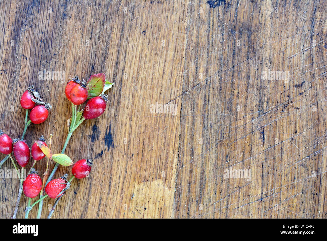 Autumn background with colorful fall leaves on rustic wooden table with ...