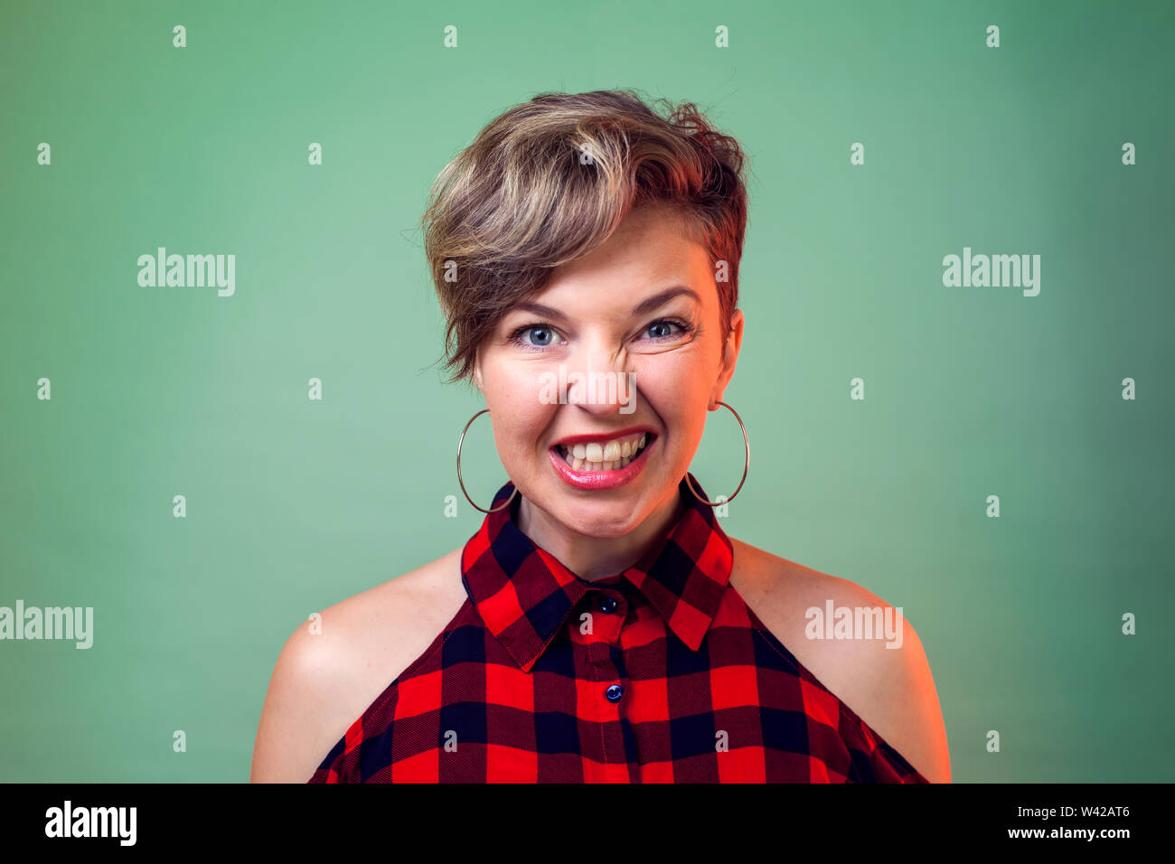 People and emotions - angry young woman with short dark hair Stock ...