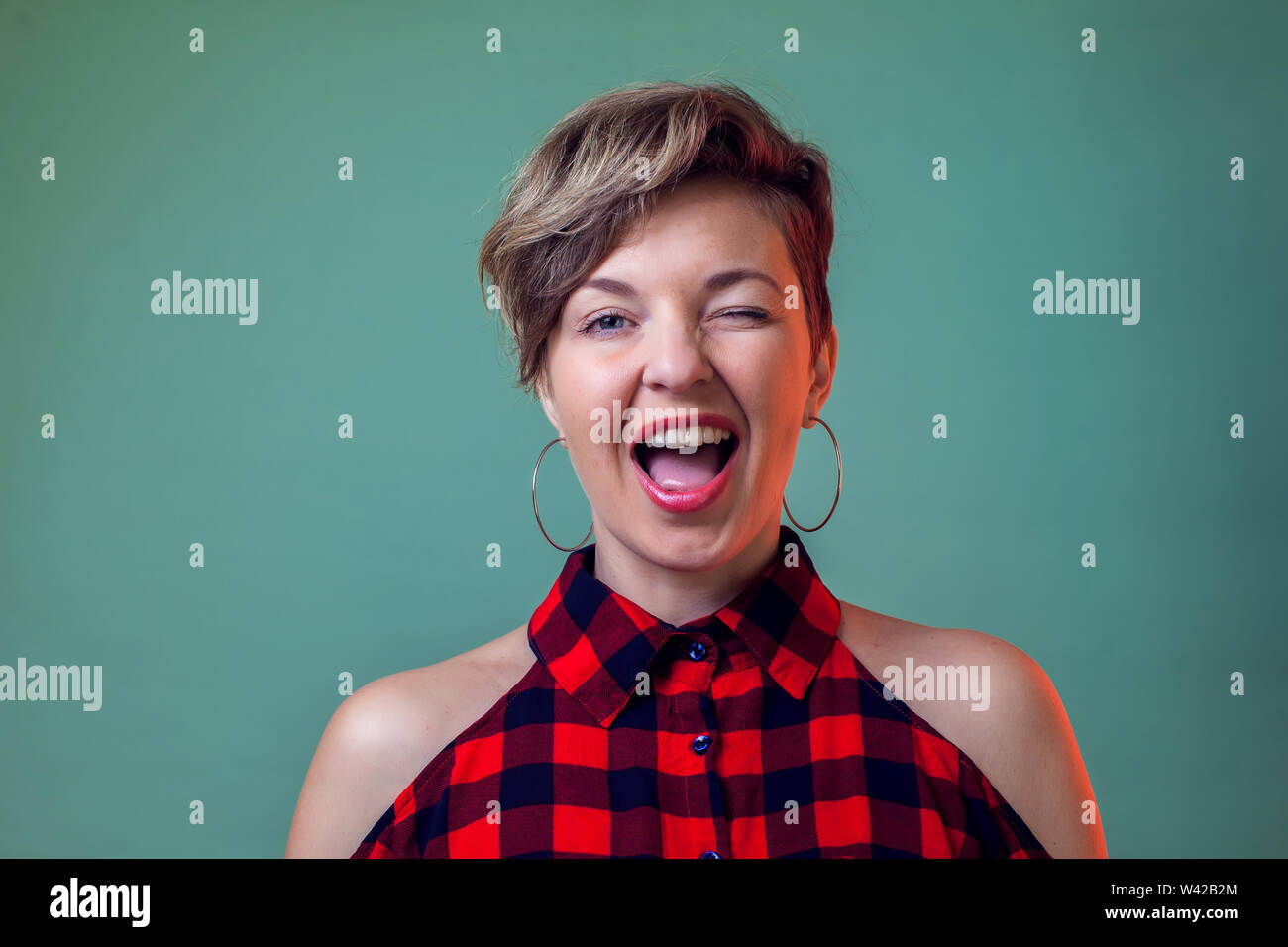 People and emotions - a portrait of happy young woman looking and ...