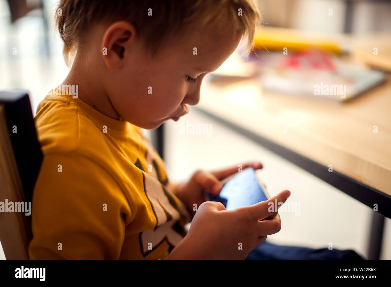 Children, technology and internet concept. Little smiling child boy ...