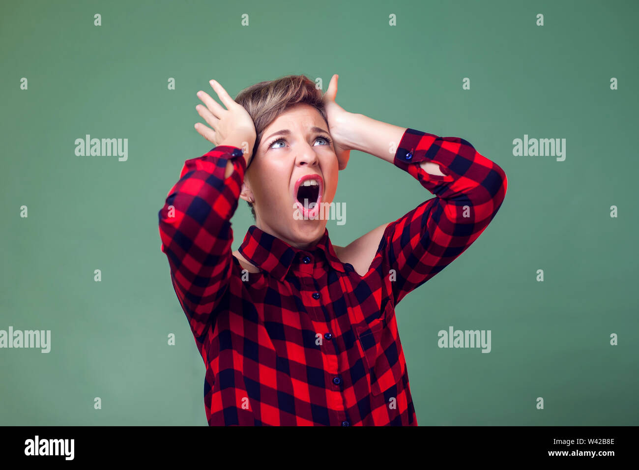People and emotions - a portrait of young woman with short hair crazy ...