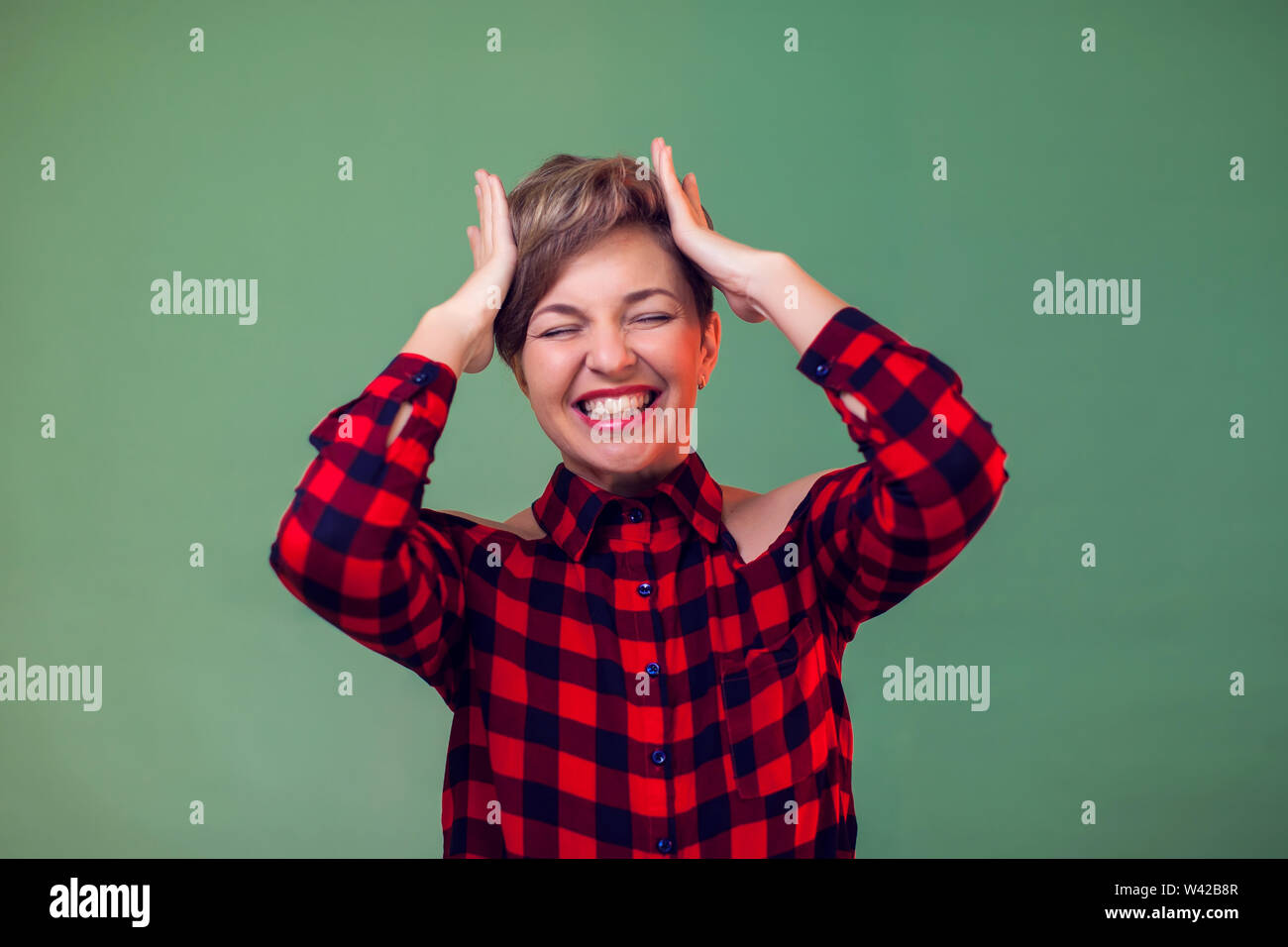 People and emotions - a portrait of young woman with short hair crazy ...