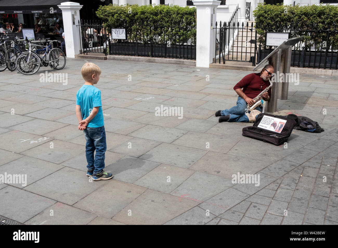 The Busker and the Boy Stock Photo - Alamy