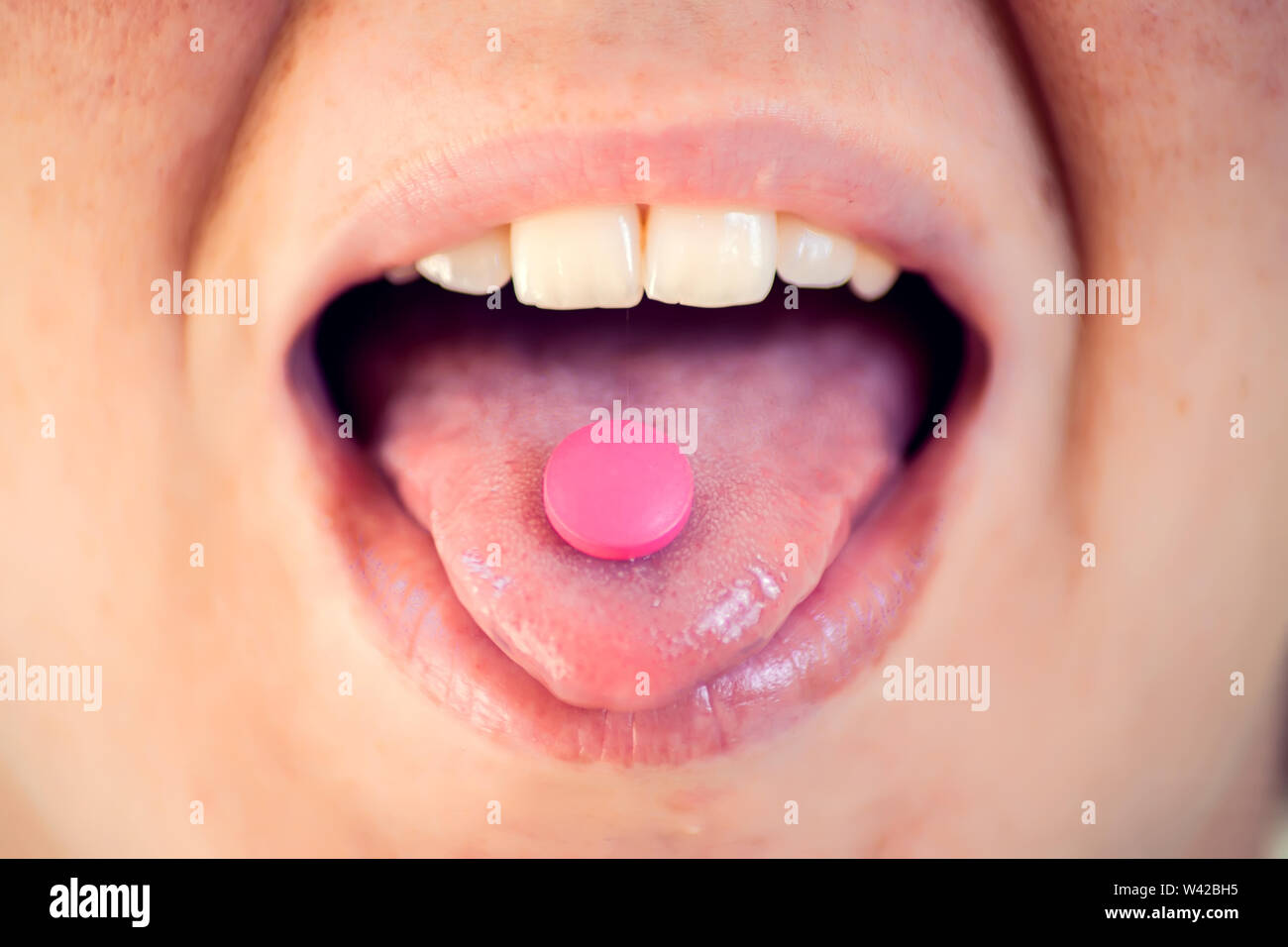 Girl open mouth tongue hi-res stock photography and images - Alamy
