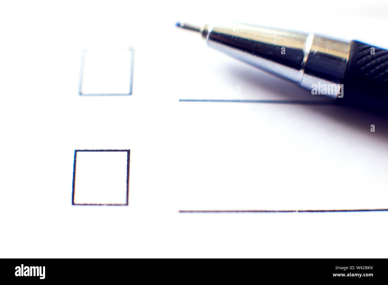 Checklist with a pen on white paper. Checkbox concept Stock Photo - Alamy