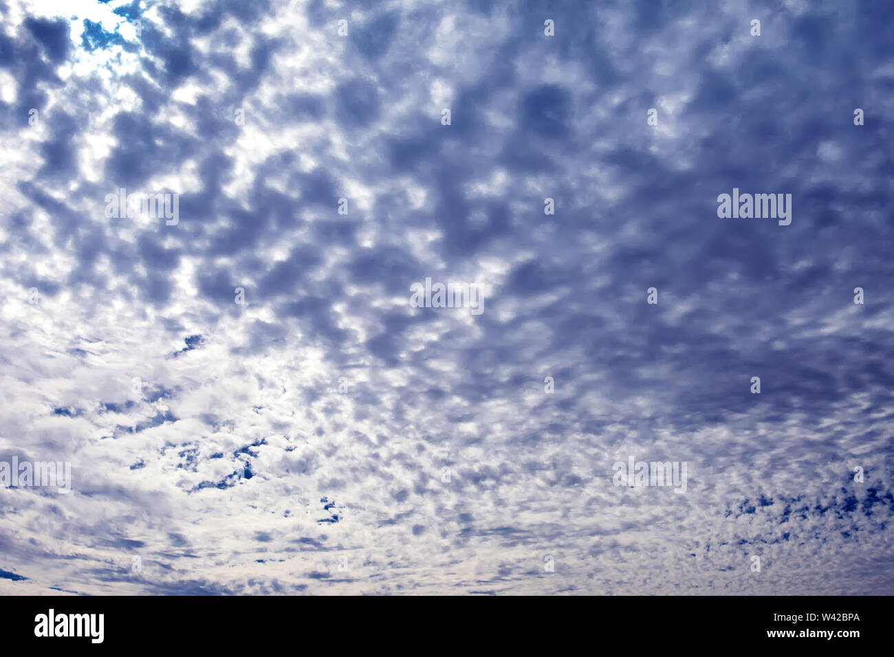Blue sky background with a tiny clouds Stock Photo - Alamy