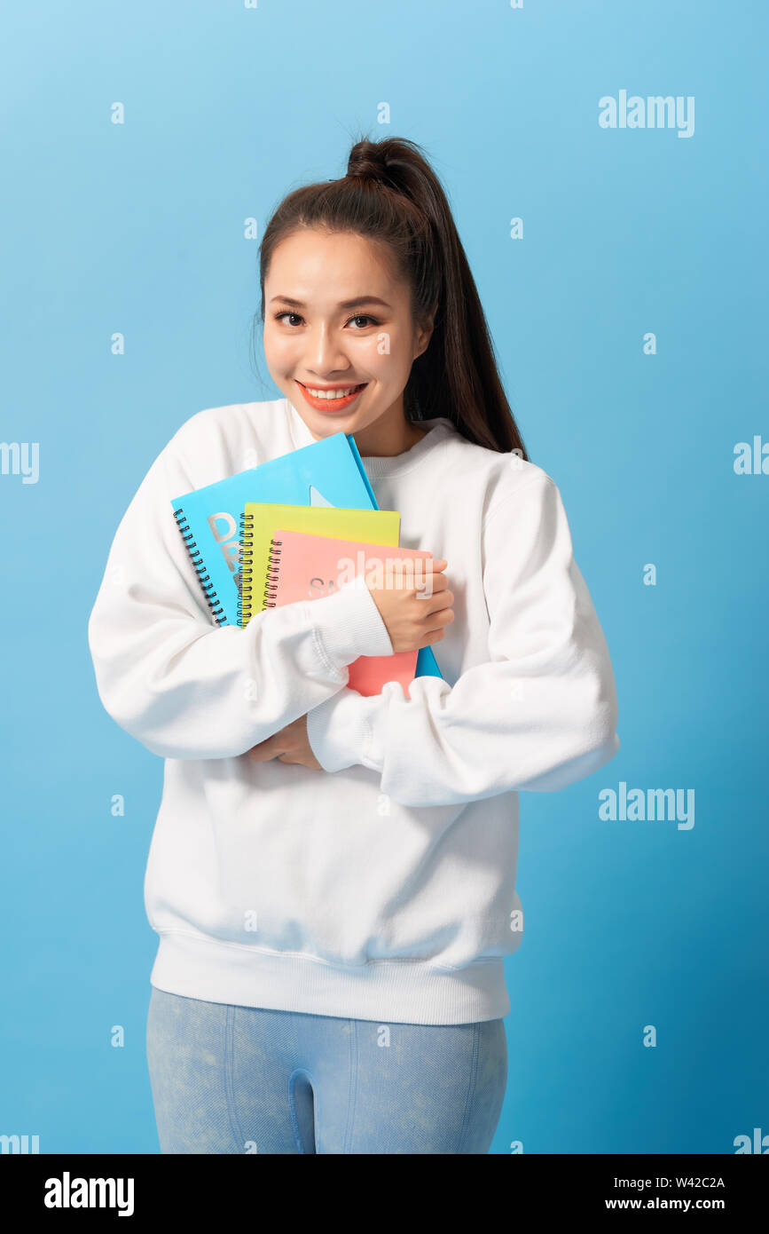 Nice female student smiling and looking at camera Stock Photo - Alamy