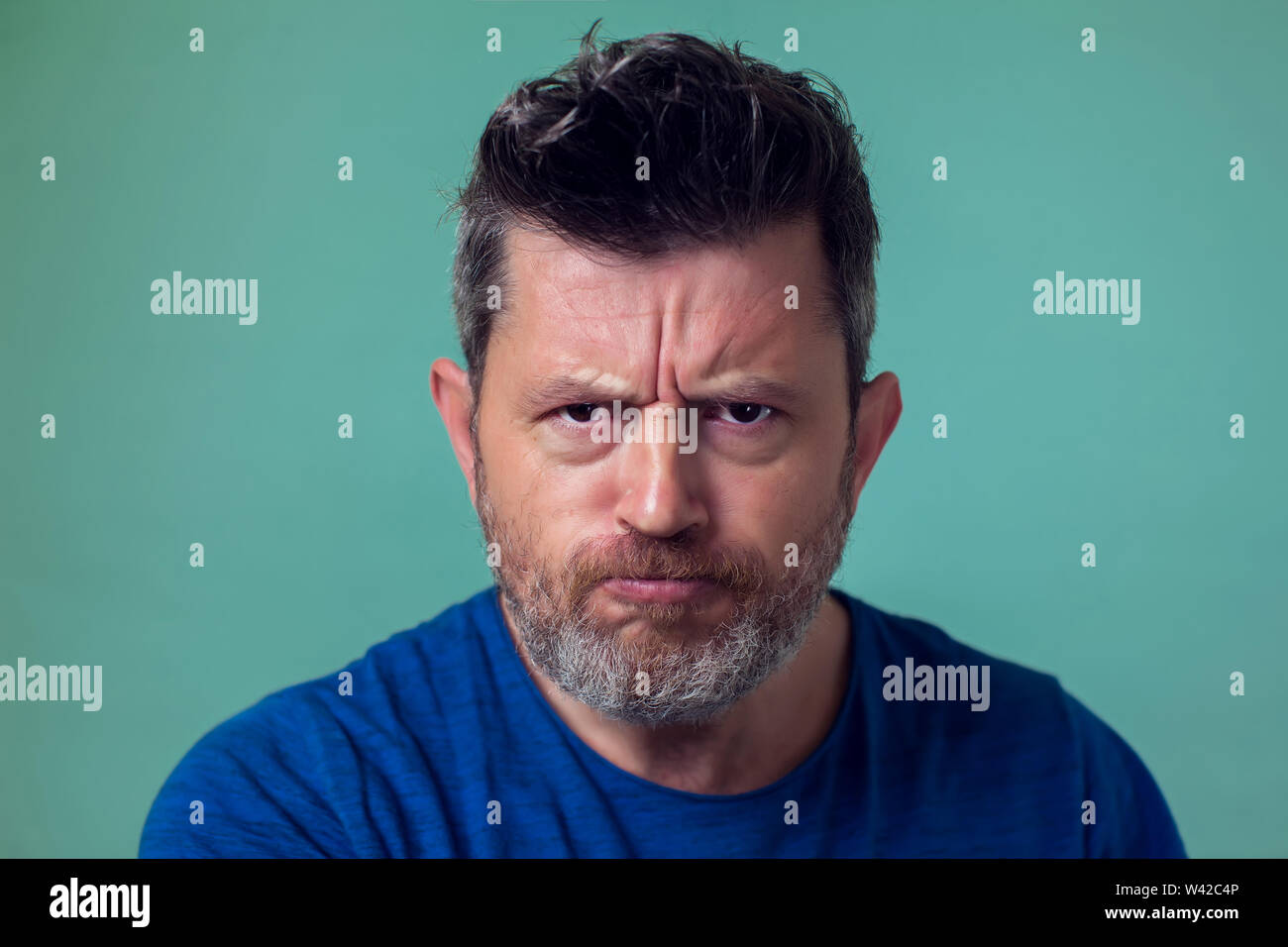 People and emotions - angry man with beard isolated Stock Photo - Alamy