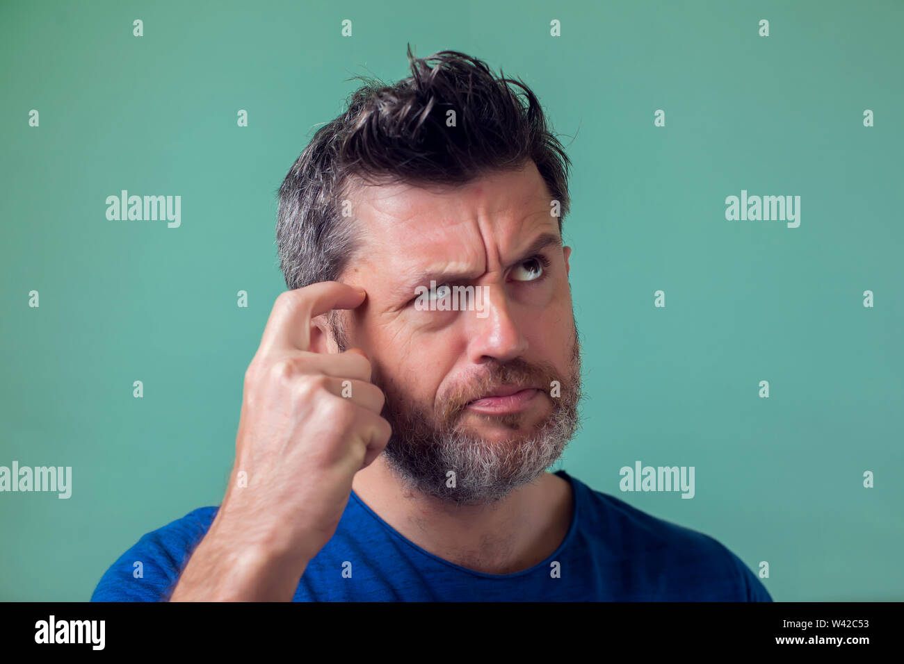 People and emotions - man with beard thinking about something Stock ...