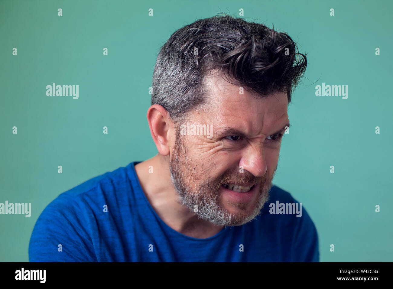 People and emotions - angry man with beard isolated Stock Photo - Alamy