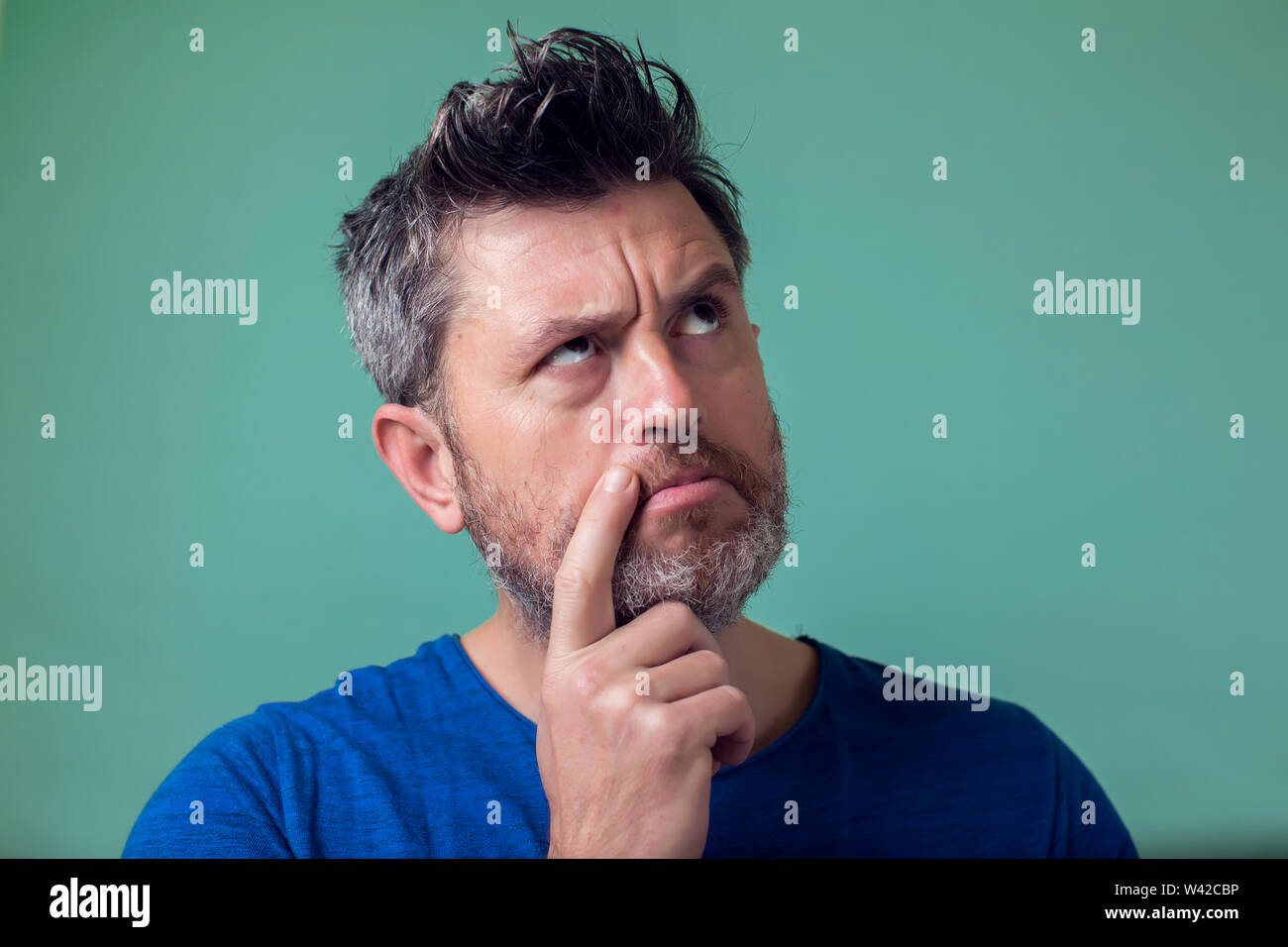 People and emotions - man with beard thinking about something Stock ...