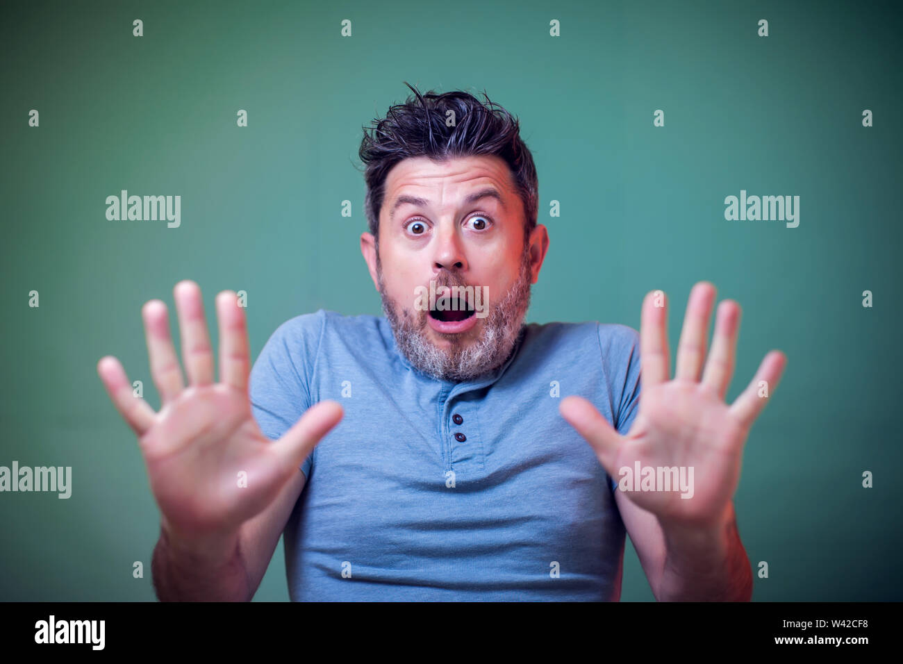 People and emotions - a portrait of man with beard scared of something ...