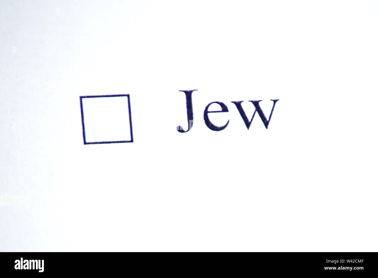 Checklist with a word Jew on white paper with pen. Checkbox and ...