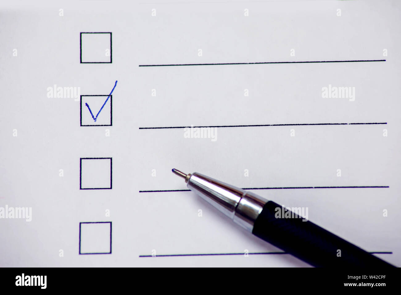 Checklist boxes with pen on white paper. Check form concept Stock Photo ...