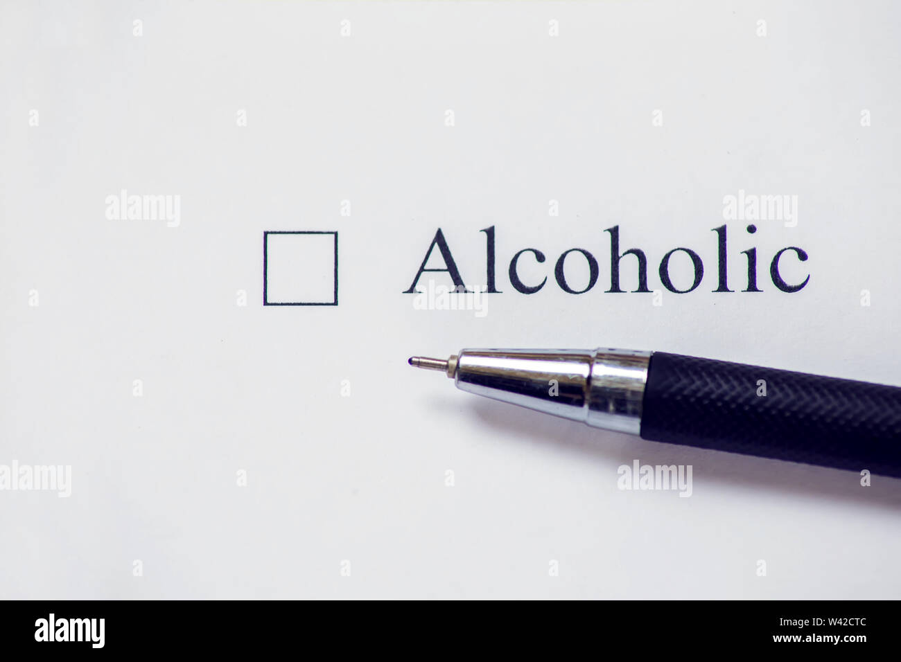 Checklist box with pen and word alcoholic. Check form and healthcare ...