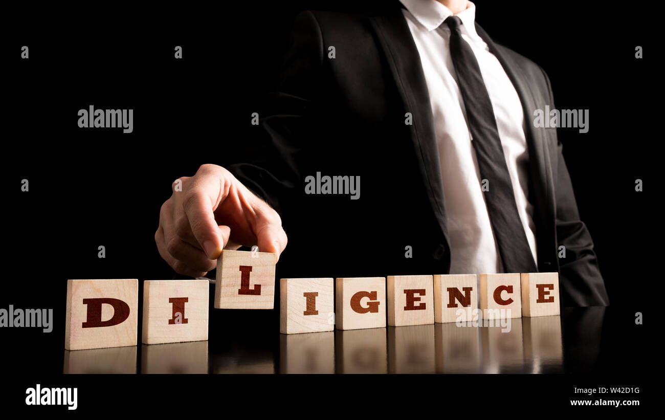 Close up Businessman in Black Business Suit Arranging Small Wooden ...