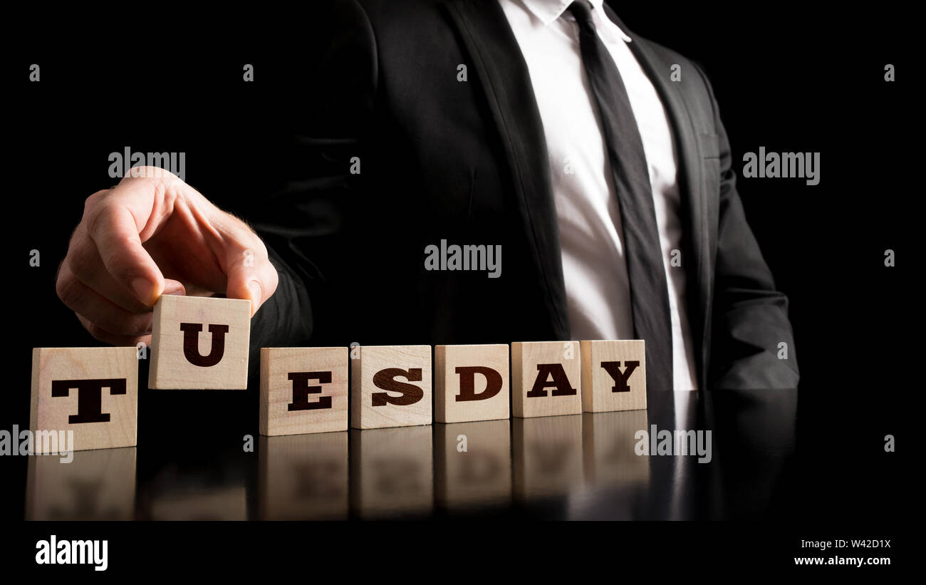 Working day - Businessman Arranging Small Wooden Blocks with word ...