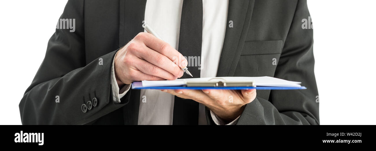 Closeup of businessman holding blue clipboard folder writing notes and ...