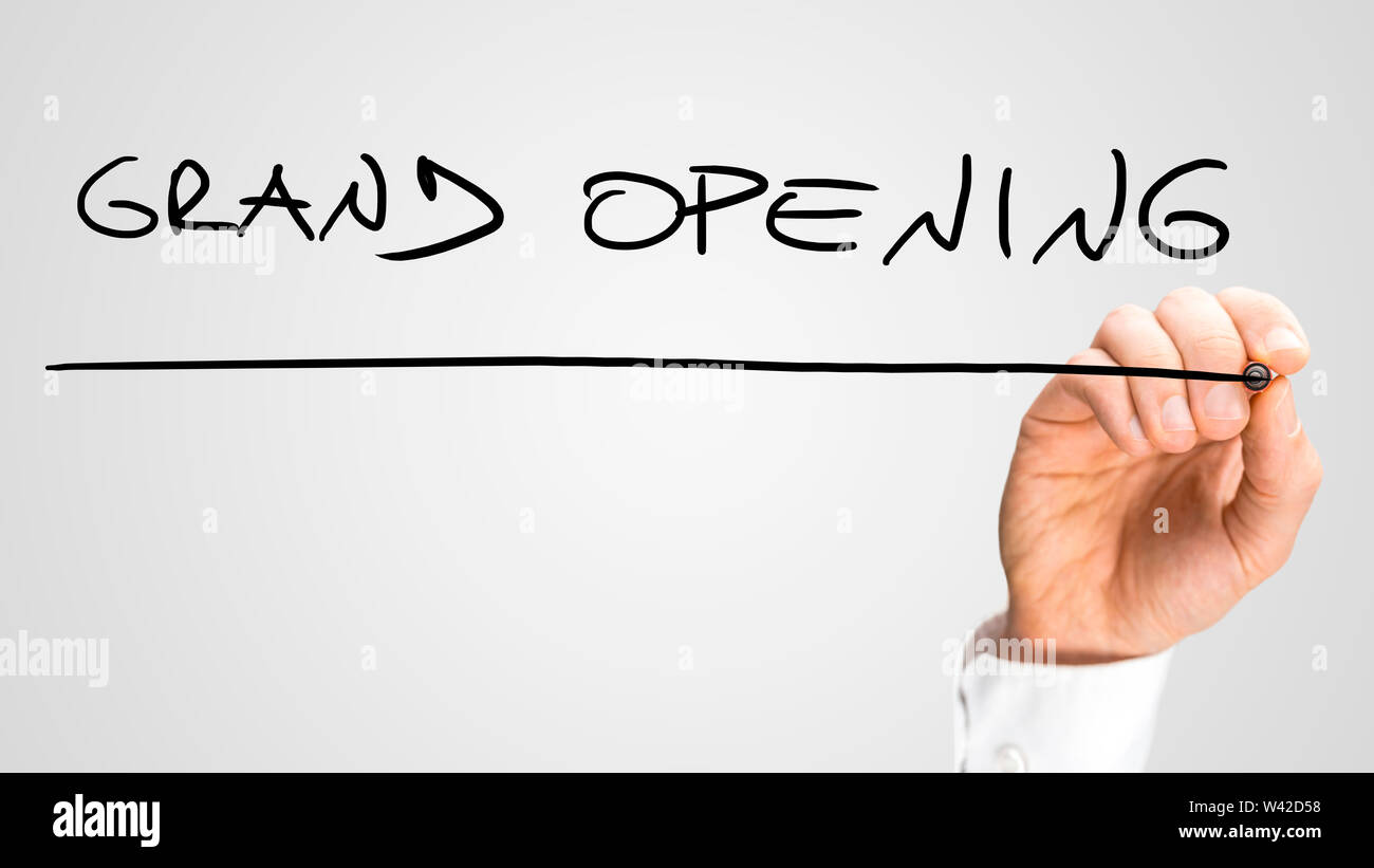 Human Hand Writing Underlined Grand Opening Texts. Isolated on Empty ...