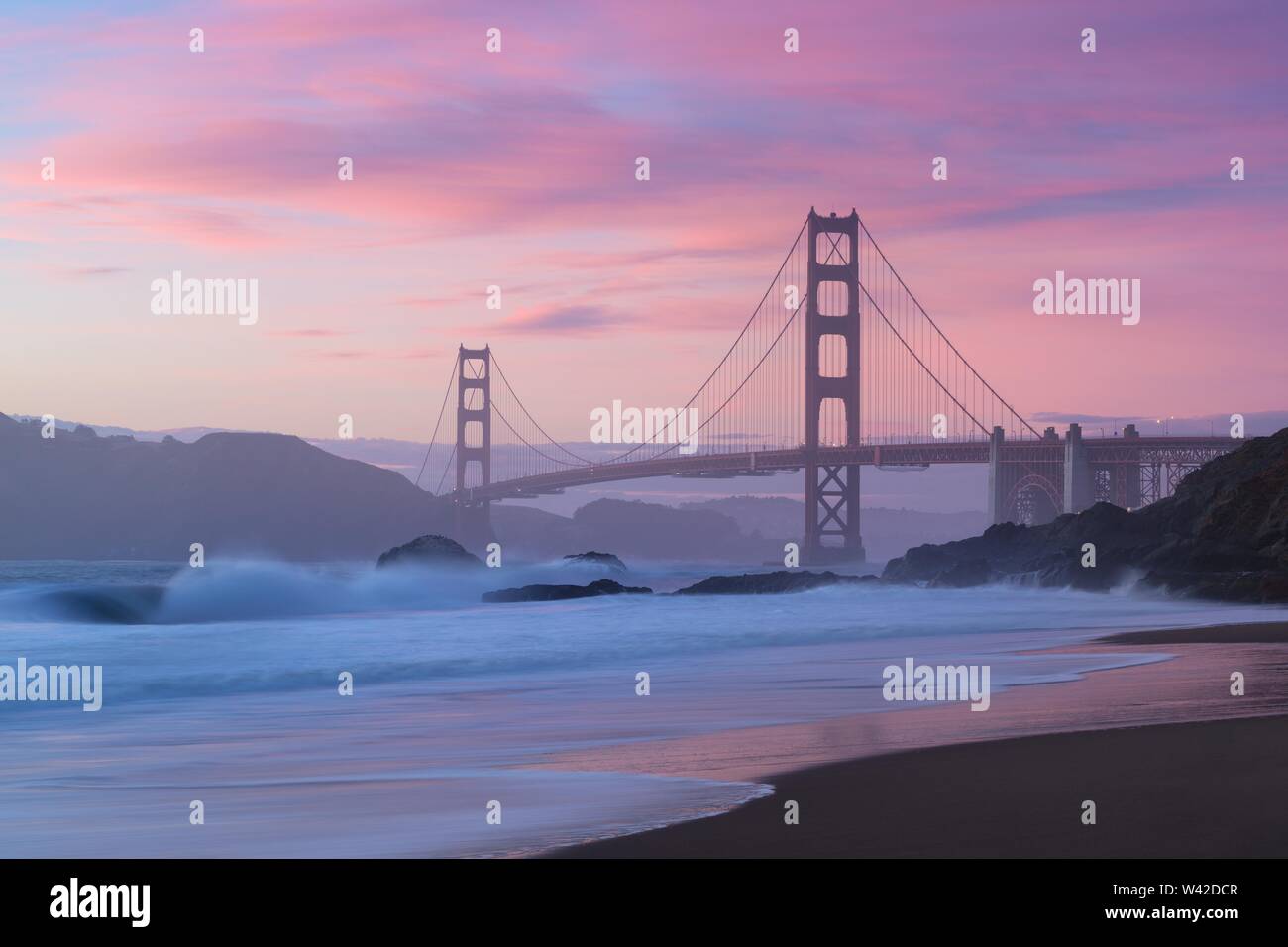 Golden Gate Bridge seen from Baker Beach in beautiful golden evening ...