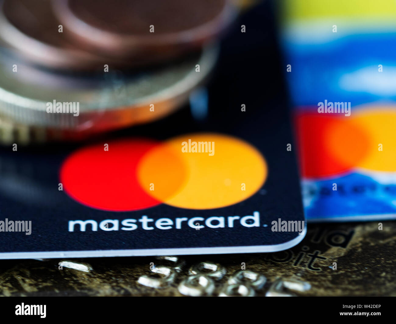 Macro of Mastercard bank cards and coins Stock Photo - Alamy