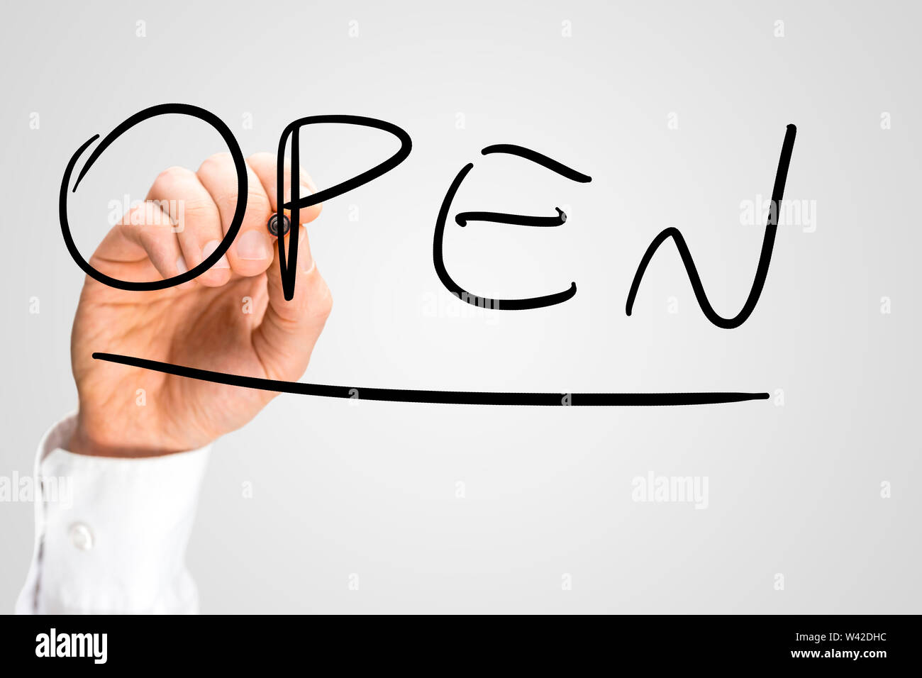 Man writing the word - Open - on a virtual screen or interface with a ...