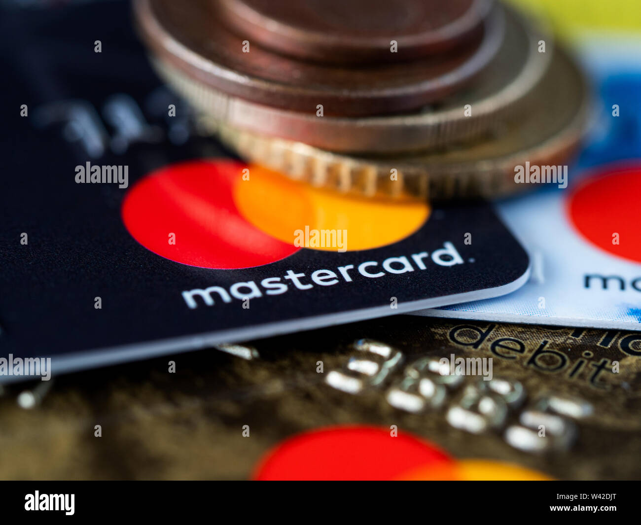 Macro of Mastercard bank cards and coins Stock Photo - Alamy
