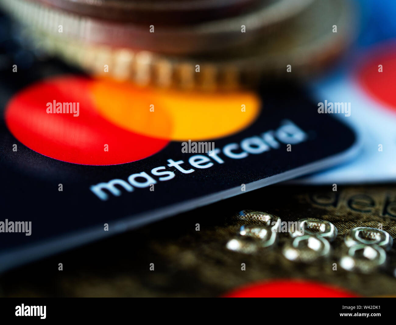 Macro of Mastercard bank cards and coins Stock Photo - Alamy