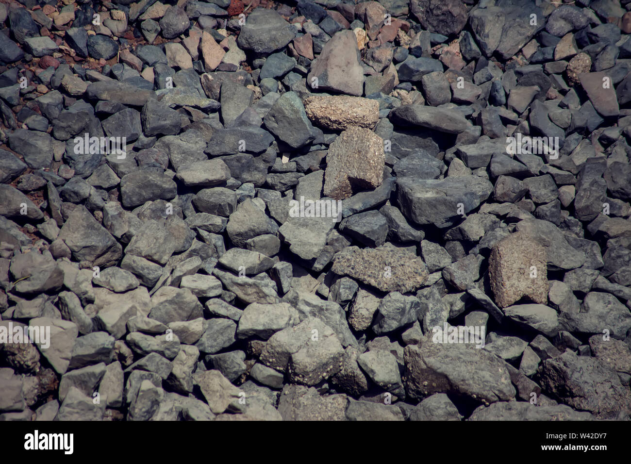 Dark rocks at the beach background. Stone texture Stock Photo - Alamy
