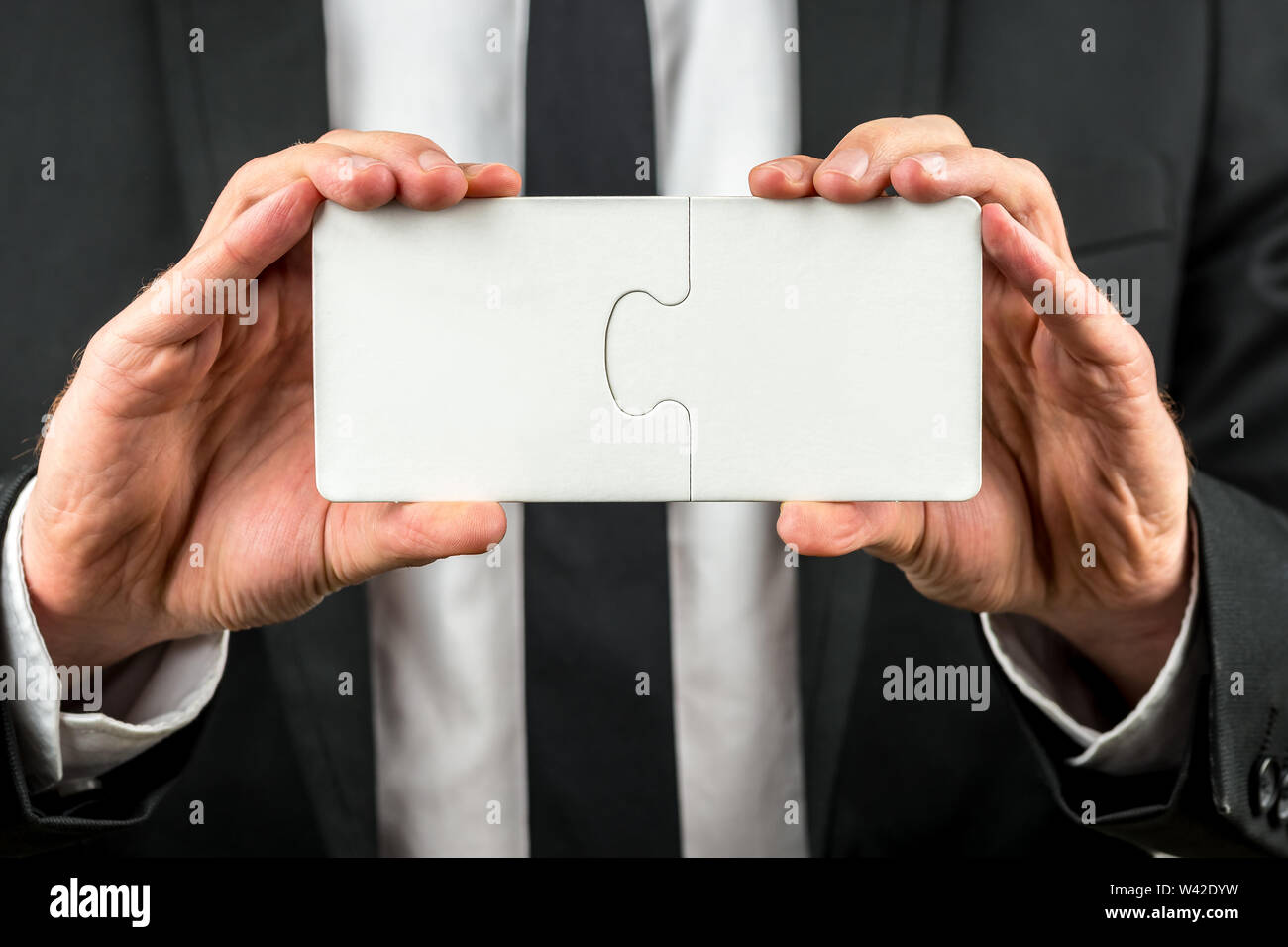 Two interlocked hands hi-res stock photography and images - Alamy
