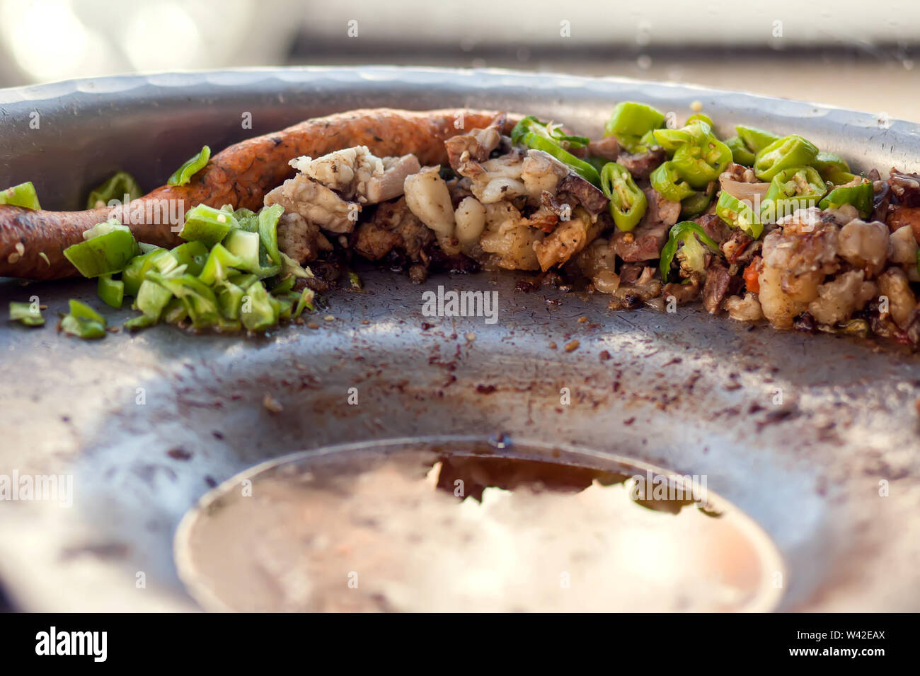 Rice-stuffed sausages called Mombar and vegetables on the plate ...