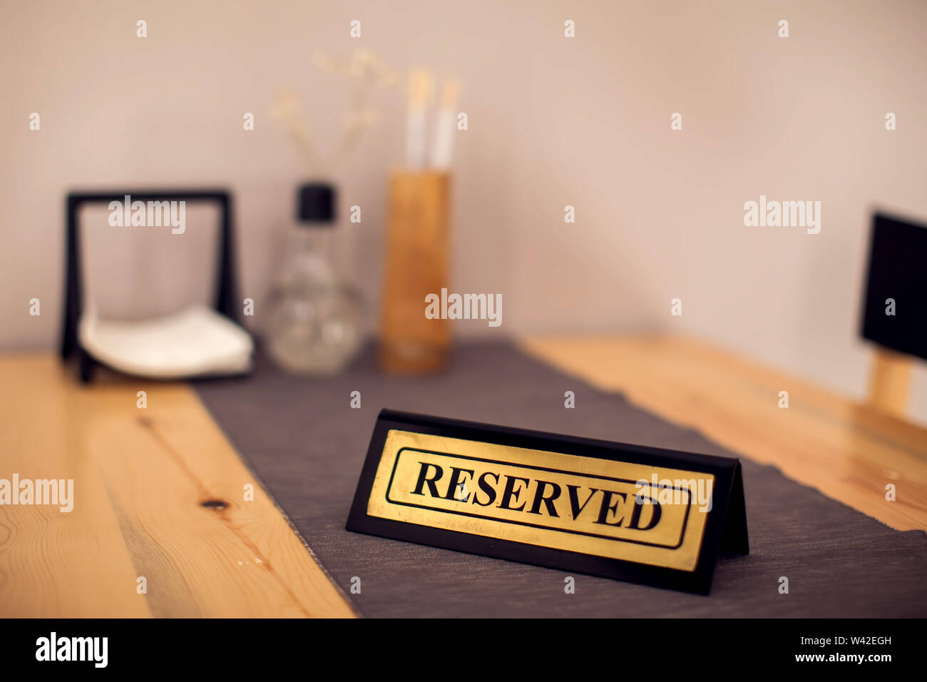 Reserved sign with capital letters on the dining table in restaurant ...