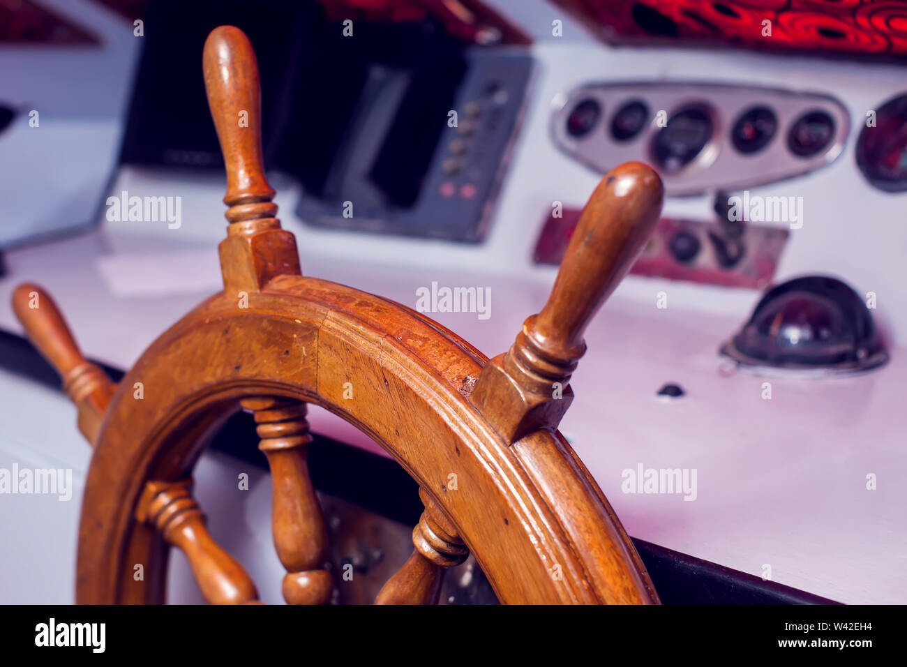Wooden steering wheel and control panel on a yacht Stock Photo - Alamy