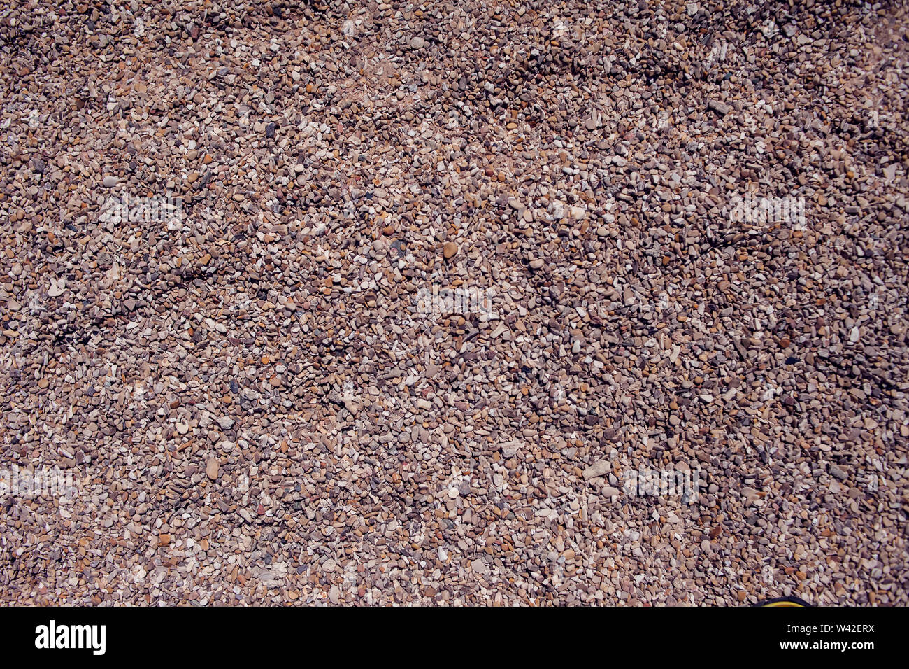 Dark sand on the beach as a background Stock Photo - Alamy