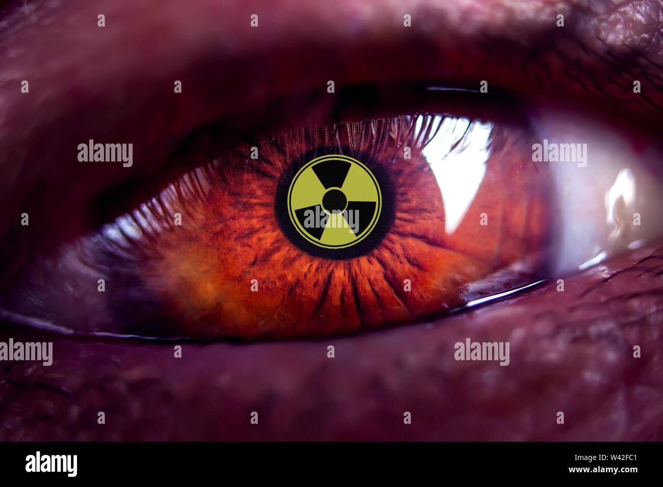 Close-up human brown eye with radiation hazard symbol - concept photo ...