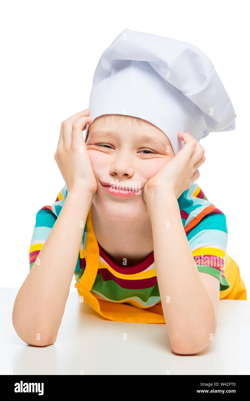 sad cook 10 years old in hat posing on white background Stock Photo - Alamy